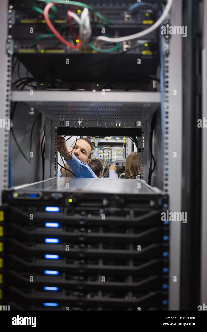 Electricians fixing wires in hallway Stock Photo - Alamy