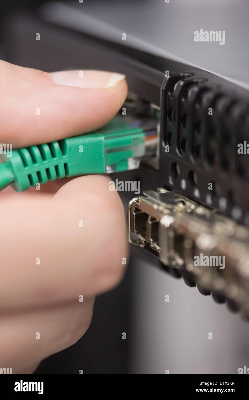 Close up hand plugging hi-res stock photography and images - Alamy