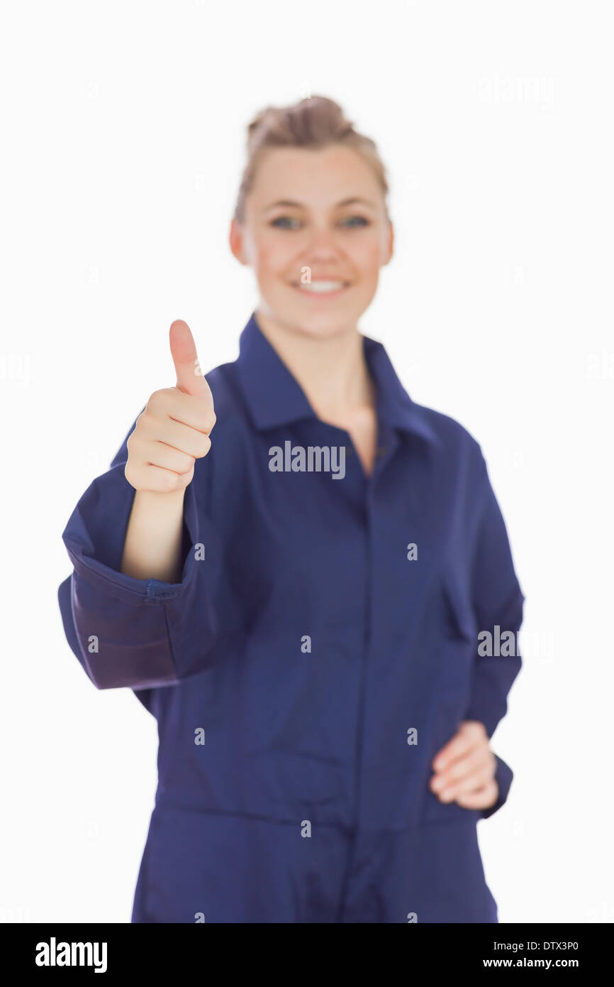 Female mechanic showing thumbs up sign Stock Photo - Alamy