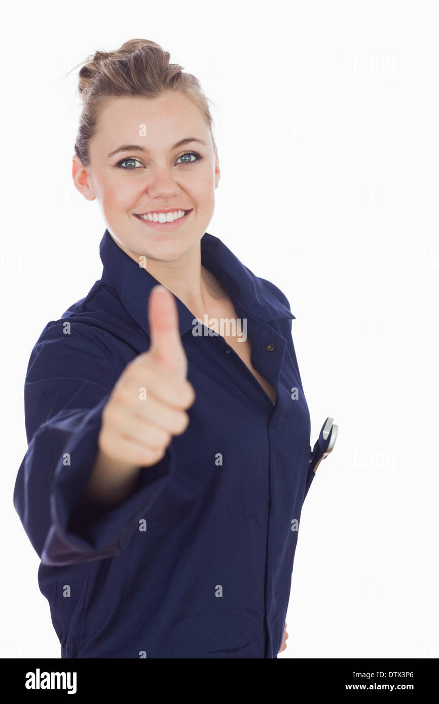 Female mechanic showing thumbs up Stock Photo - Alamy