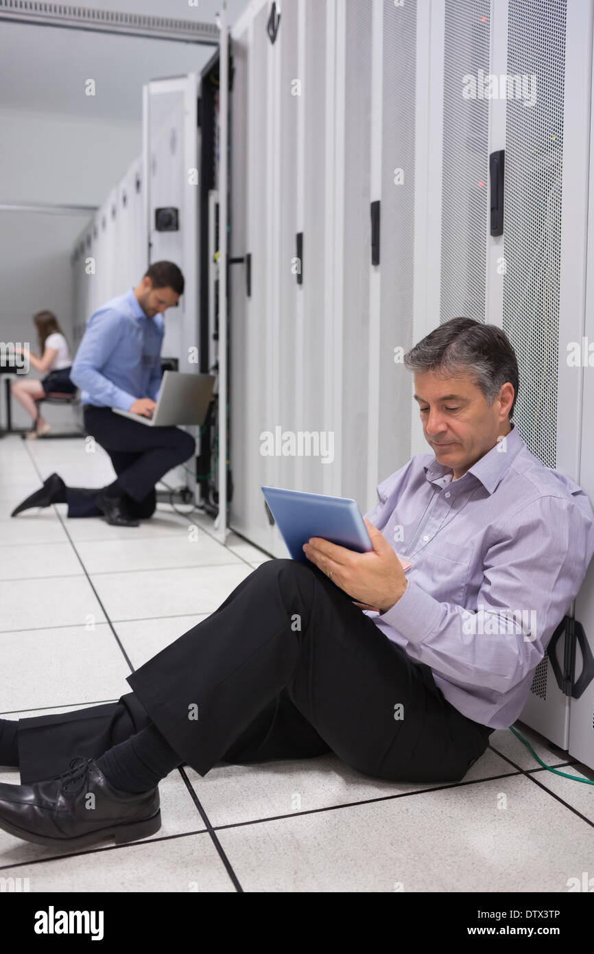 Technicians working on data stores Stock Photo - Alamy