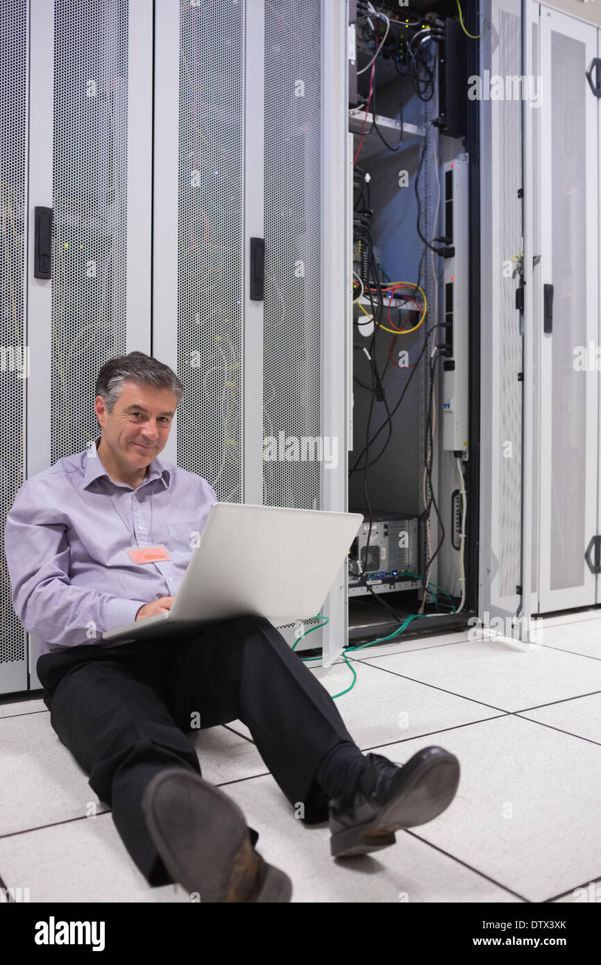Technician repairing a server on the floor Stock Photo - Alamy