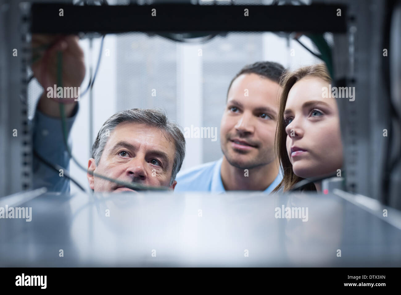 People looking into a server Stock Photo - Alamy