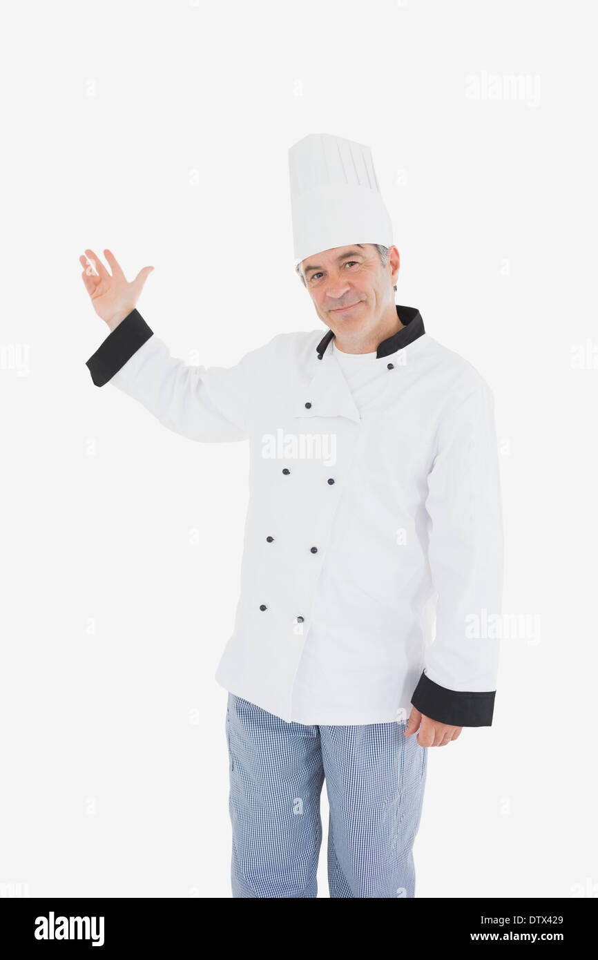 Chef showing something on white Stock Photo - Alamy