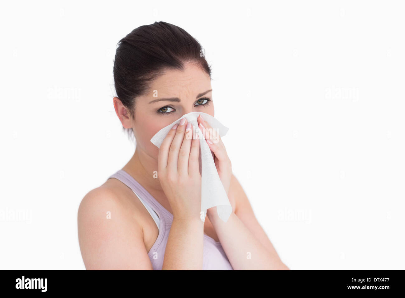 Sad woman blowing her nose Stock Photo - Alamy