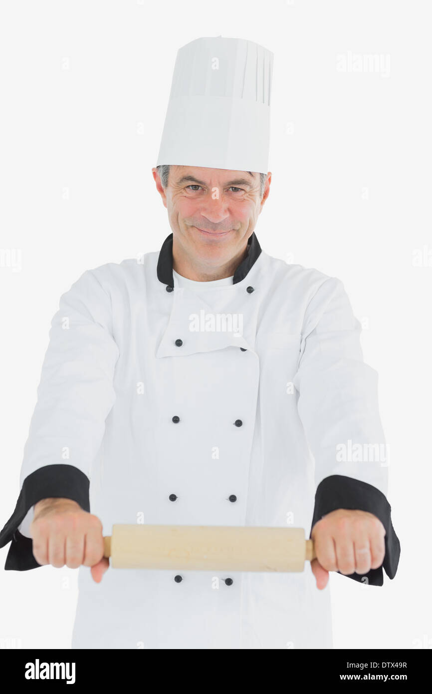 Male chef using rolling pin Stock Photo - Alamy