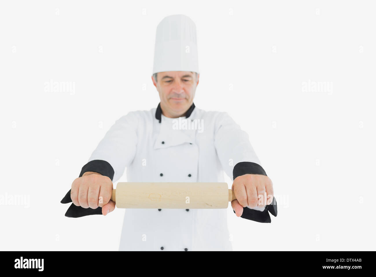 Male chef holding rolling pin Stock Photo - Alamy