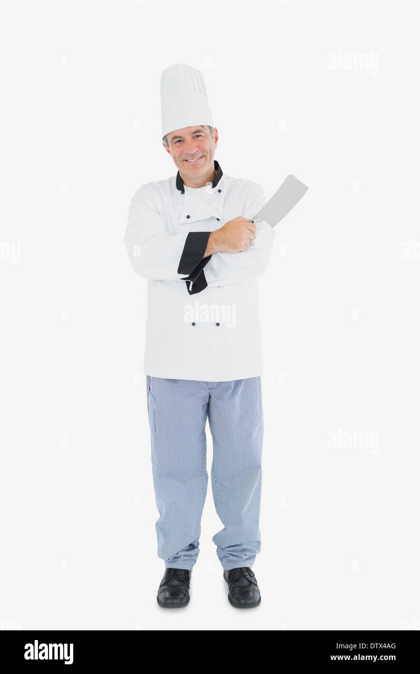 Man in chef uniform holding meat cleaver Stock Photo - Alamy
