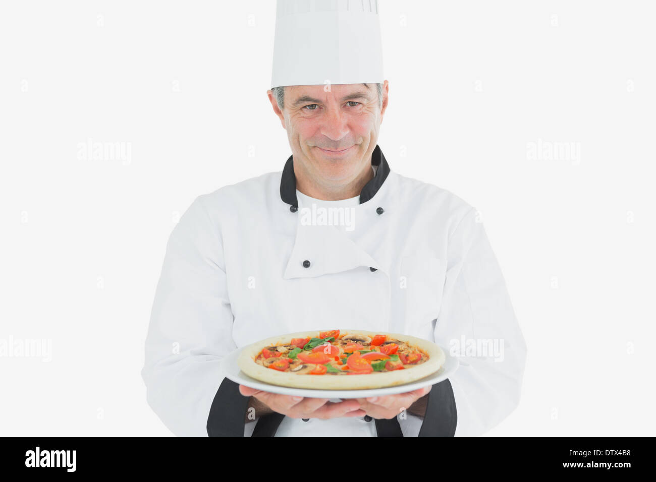 Male chef holding pizza Stock Photo - Alamy