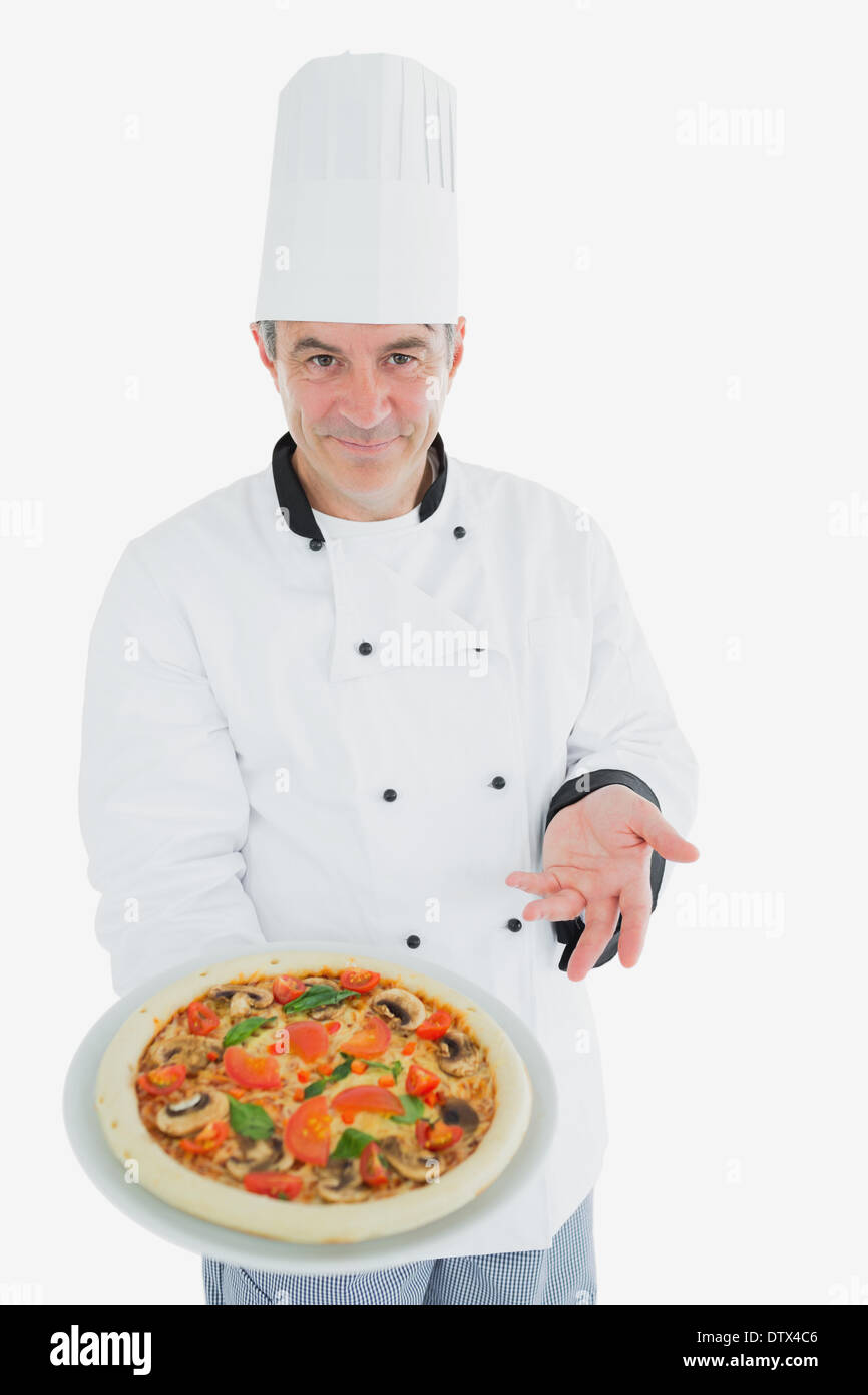Chef displaying delicious pizza Stock Photo - Alamy