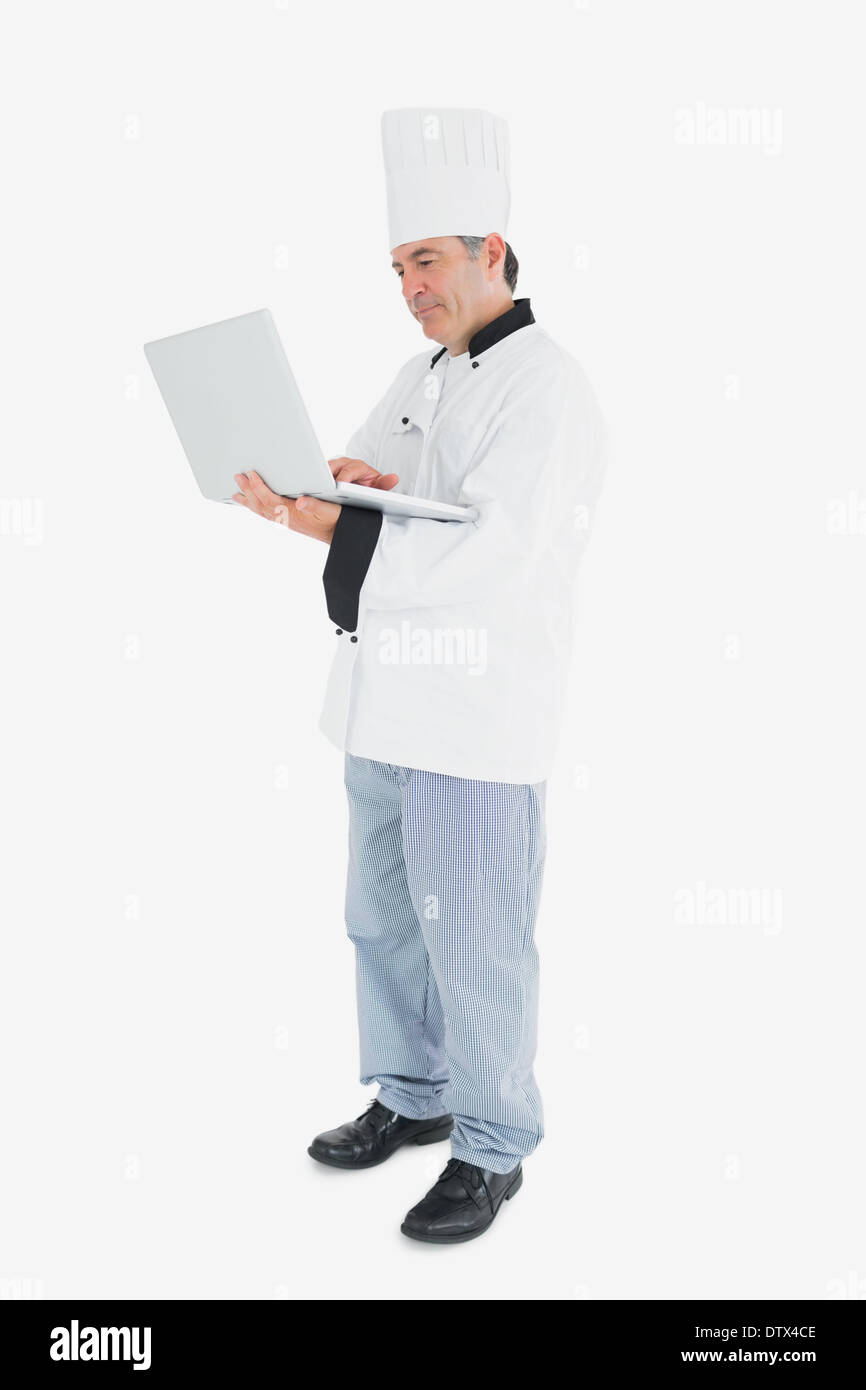 Chef using laptop Stock Photo - Alamy