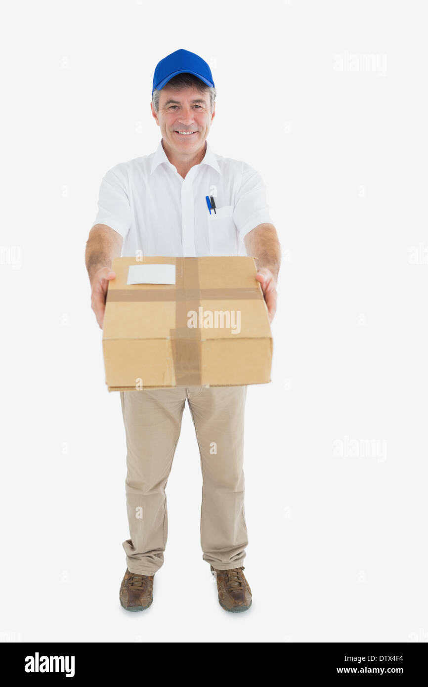 Mature delivery man handing package Stock Photo - Alamy