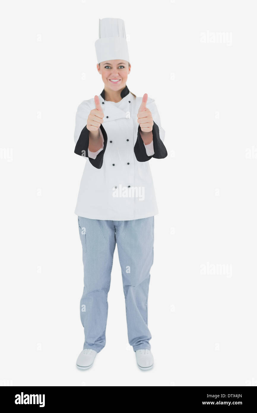 Female chef gesturing thumbs up sign Stock Photo - Alamy