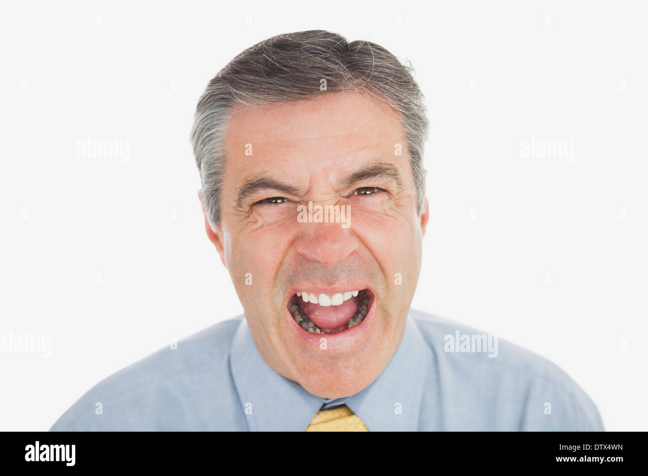 Mature businessman shouting Stock Photo - Alamy