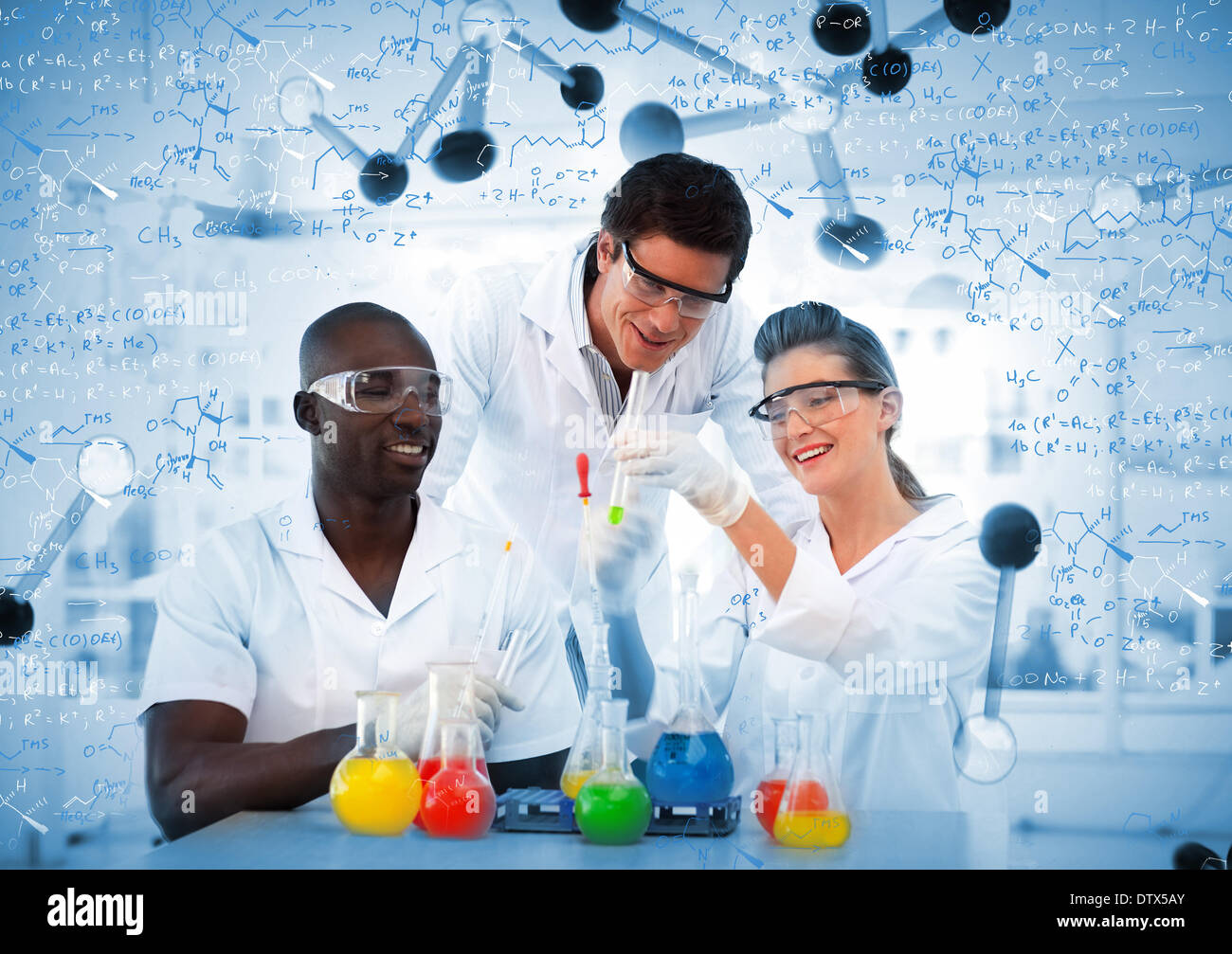 Smiling scientist examining chemical test tube hi-res stock photography ...