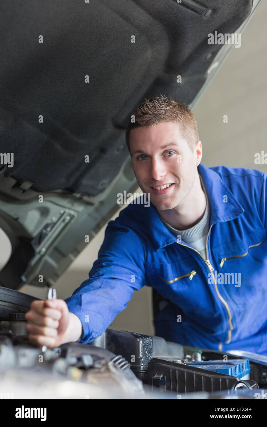 Mechanic working on motor hi-res stock photography and images - Alamy