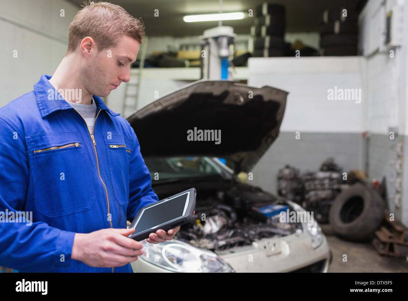 Mechanic garage tablet hi-res stock photography and images - Alamy