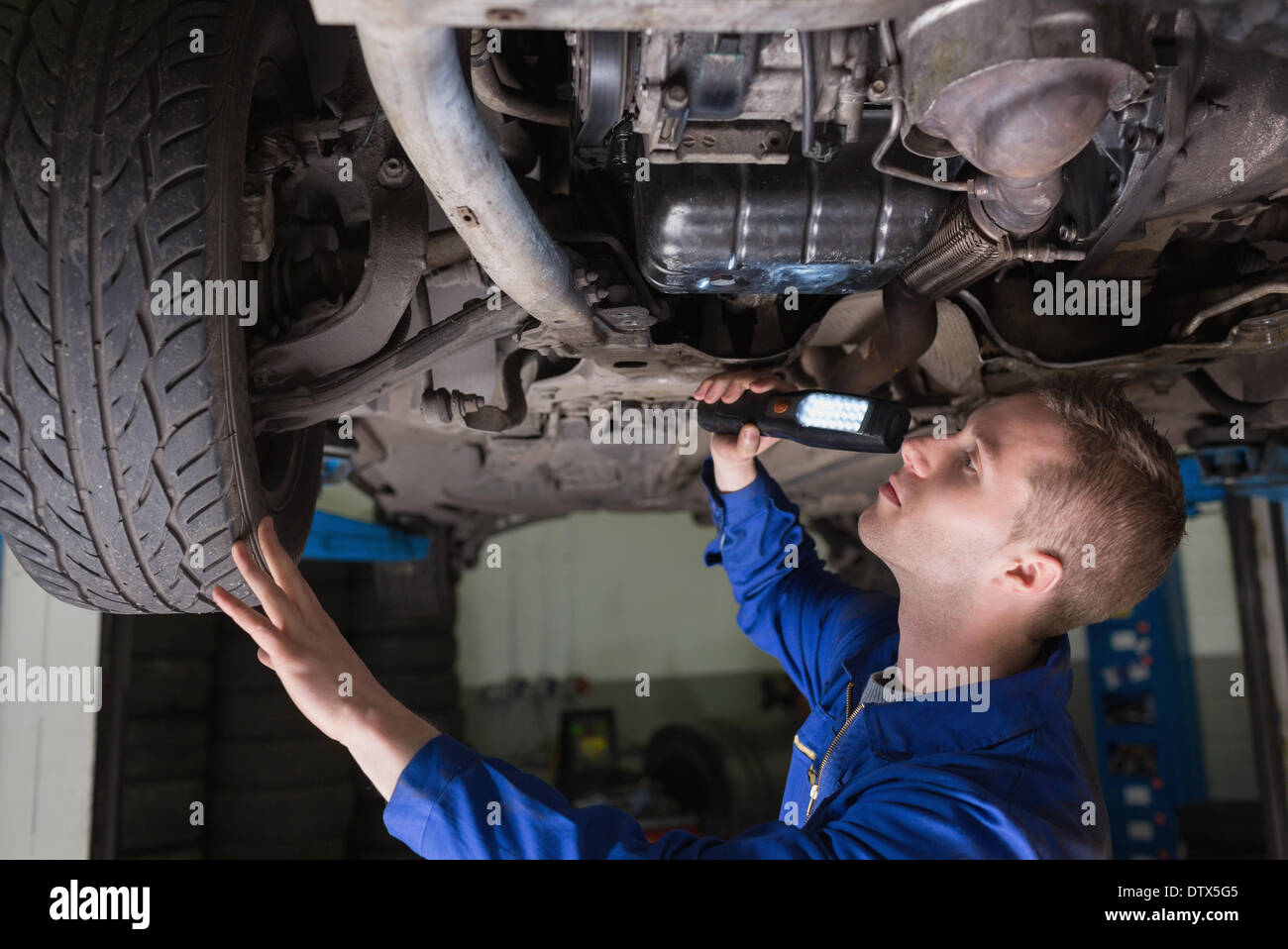 Mechanic flashlight fixing car hi-res stock photography and images - Alamy