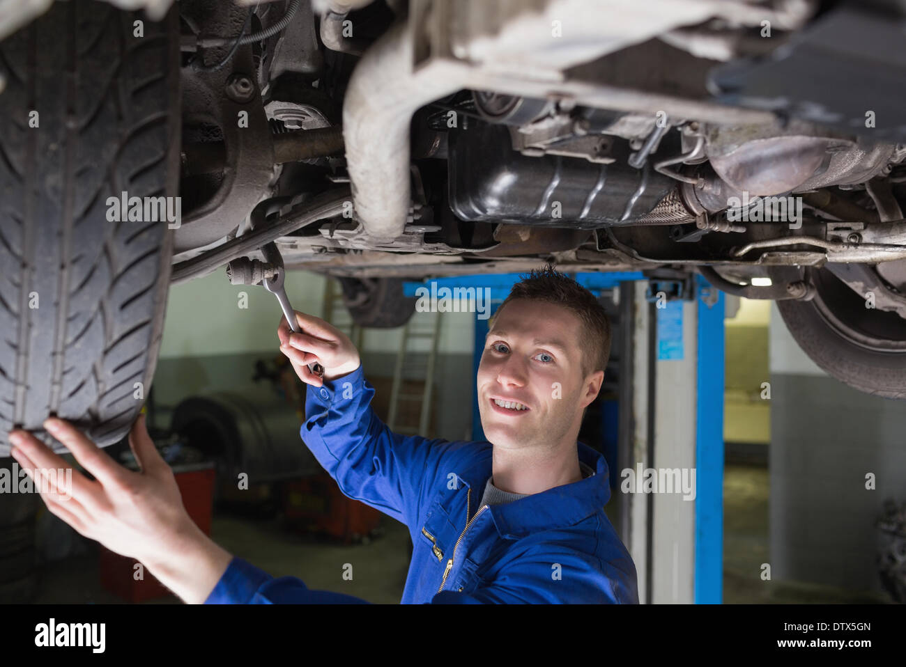 Man repairing car in garage hi-res stock photography and images - Alamy