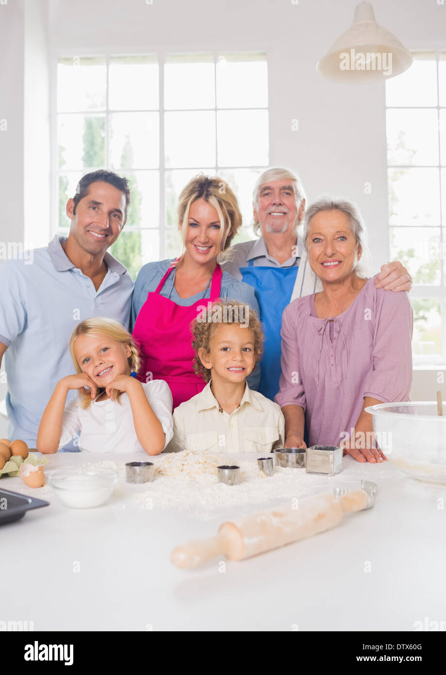 Smiling family preparing to cook Stock Photo - Alamy
