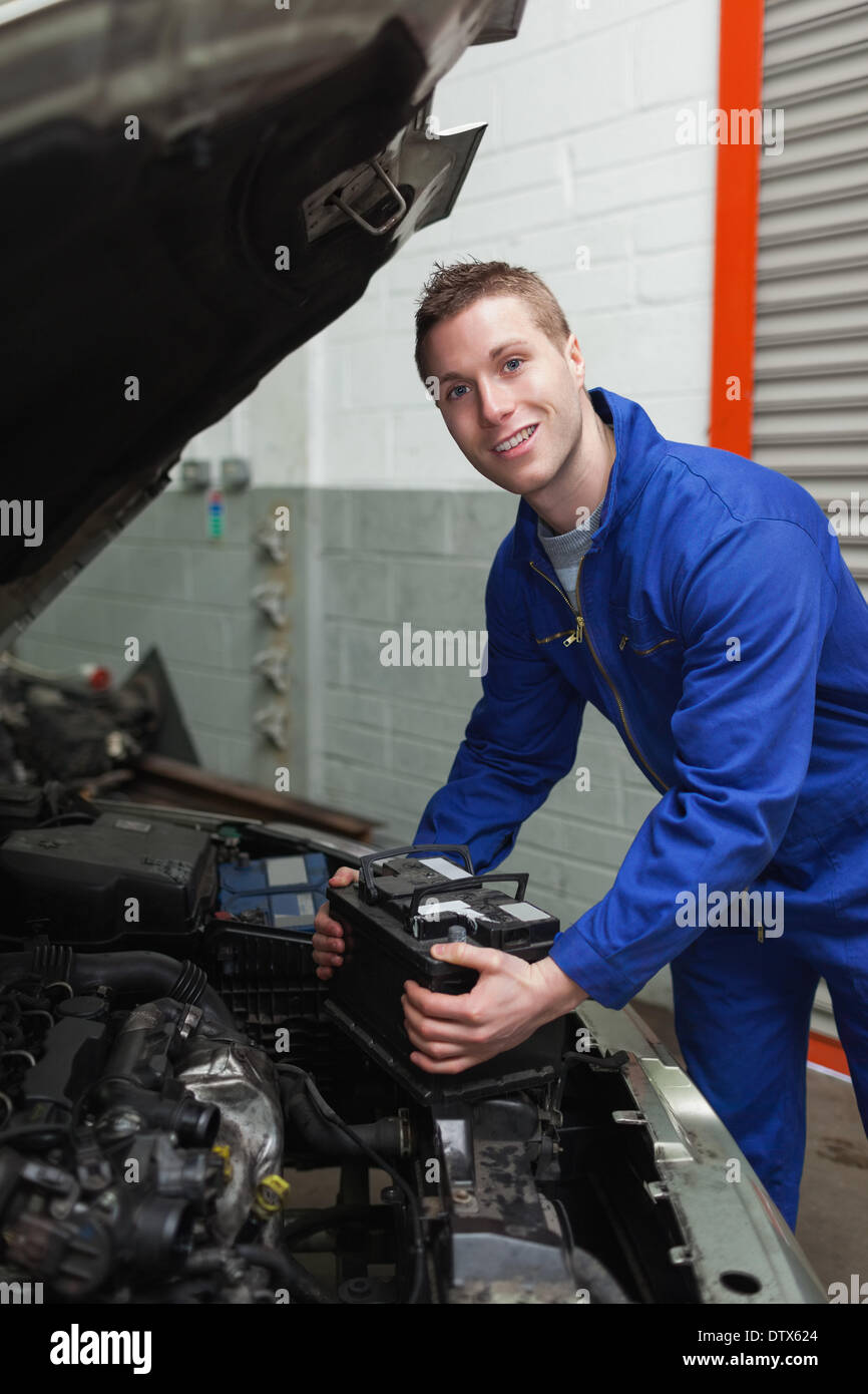Mechanic checking car battery repairman hi-res stock photography and ...