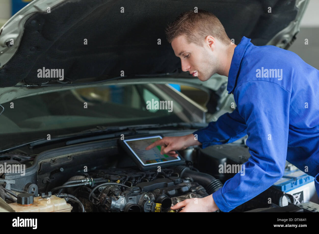 Mechanic tablet pc repairing car hi-res stock photography and images ...