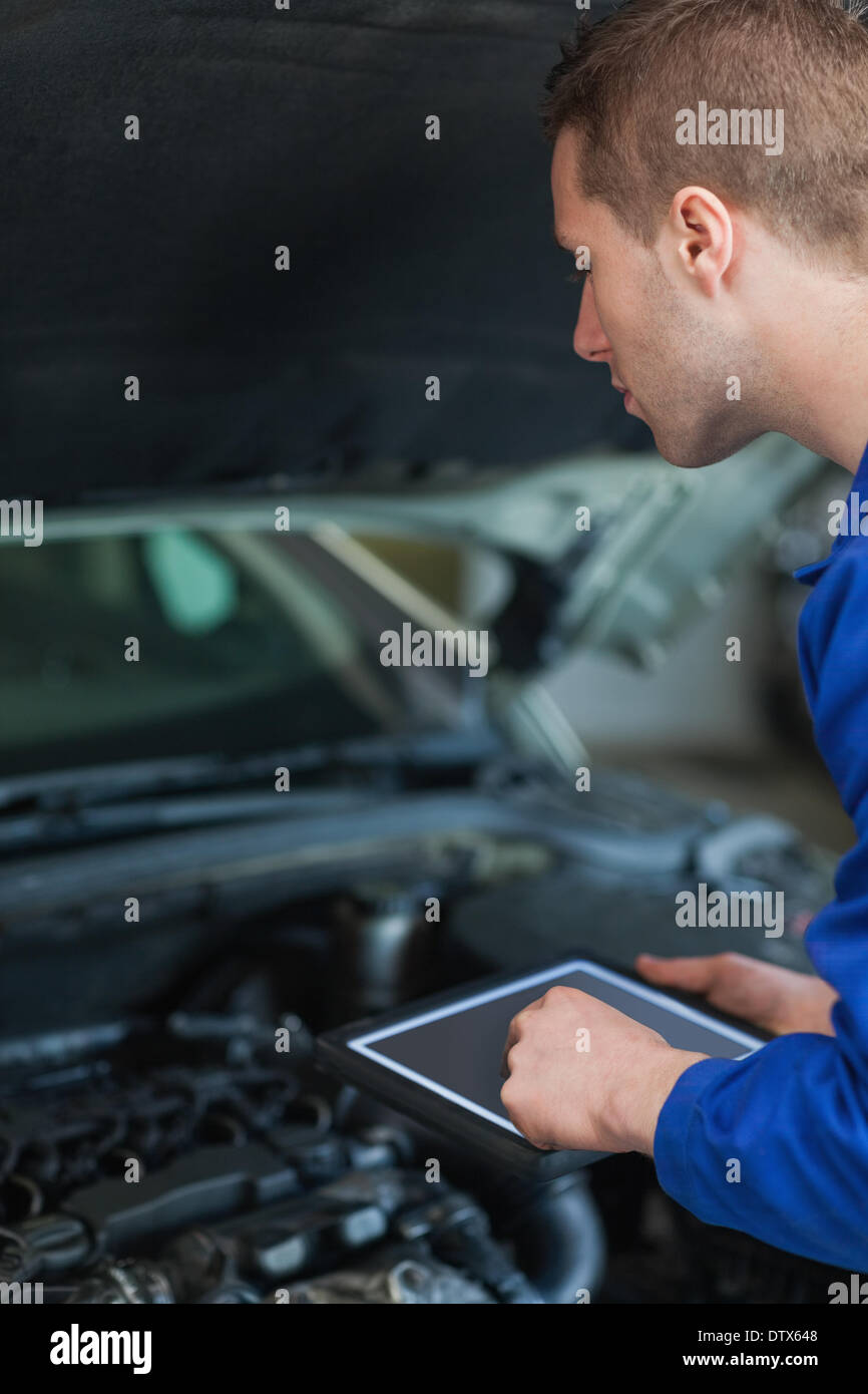 Mechanic tablet pc repairing car hi-res stock photography and images ...