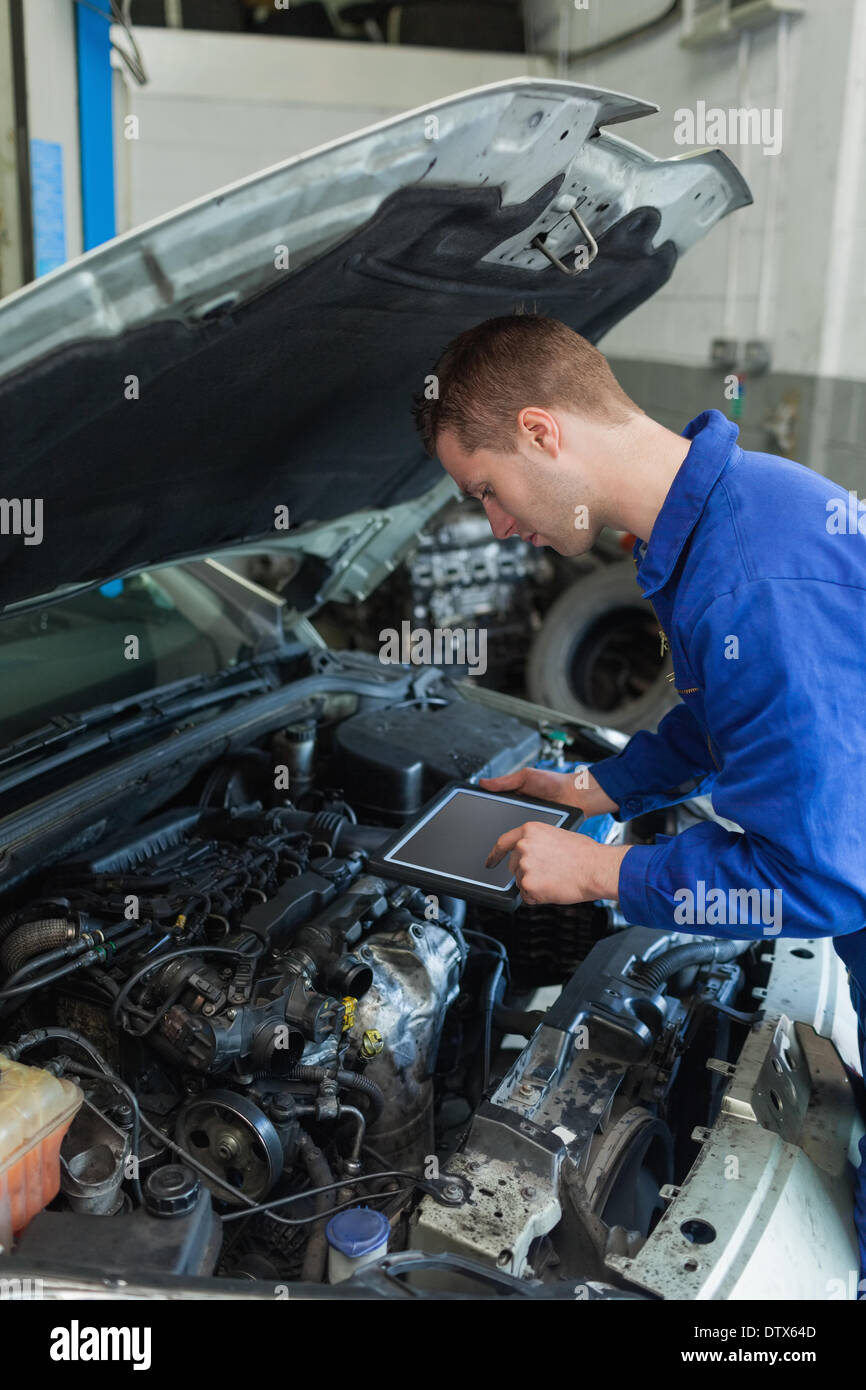 Mechanic tablet pc repairing car hi-res stock photography and images ...