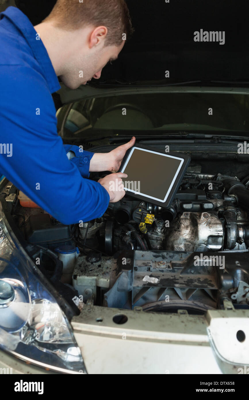 Fixing computer tablet hi-res stock photography and images - Alamy