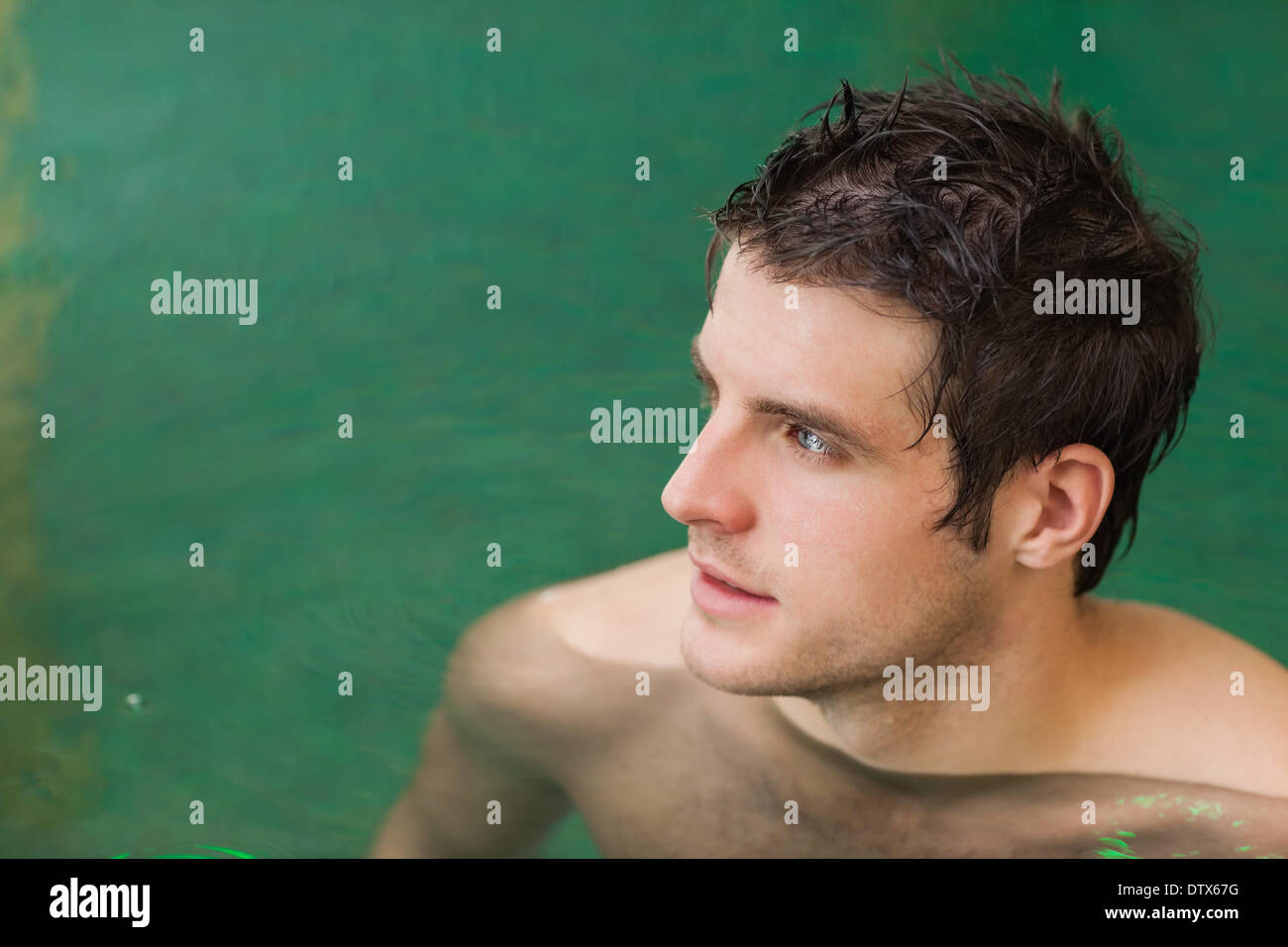 Attractive man in swimming pool Stock Photo - Alamy