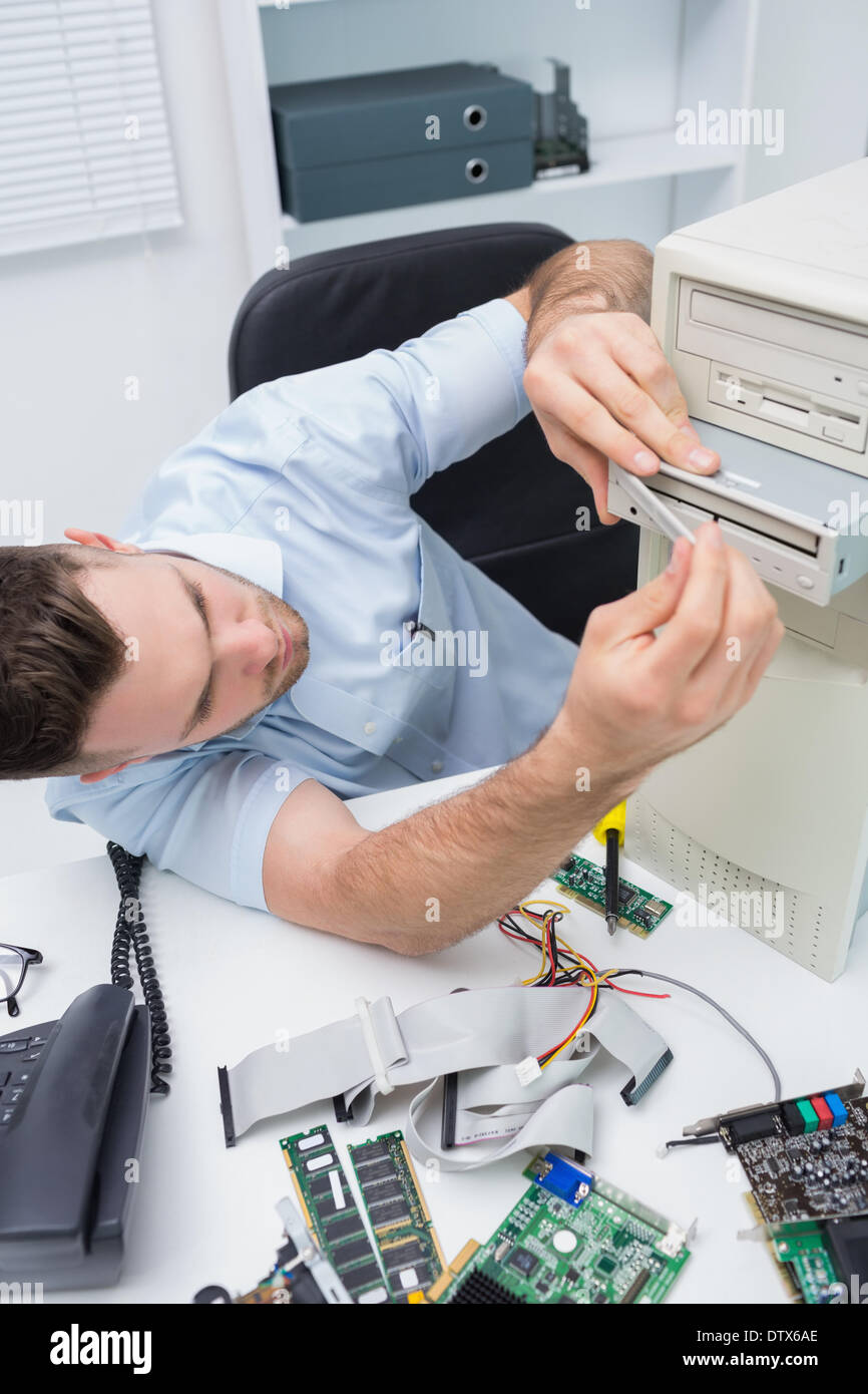 Young it professional working on cpu Stock Photo - Alamy