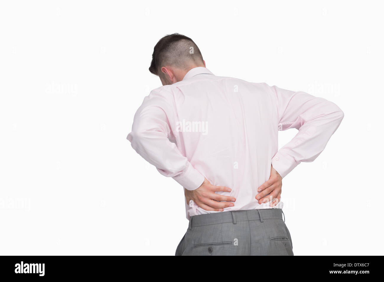 Rear view of business man with back pain Stock Photo - Alamy