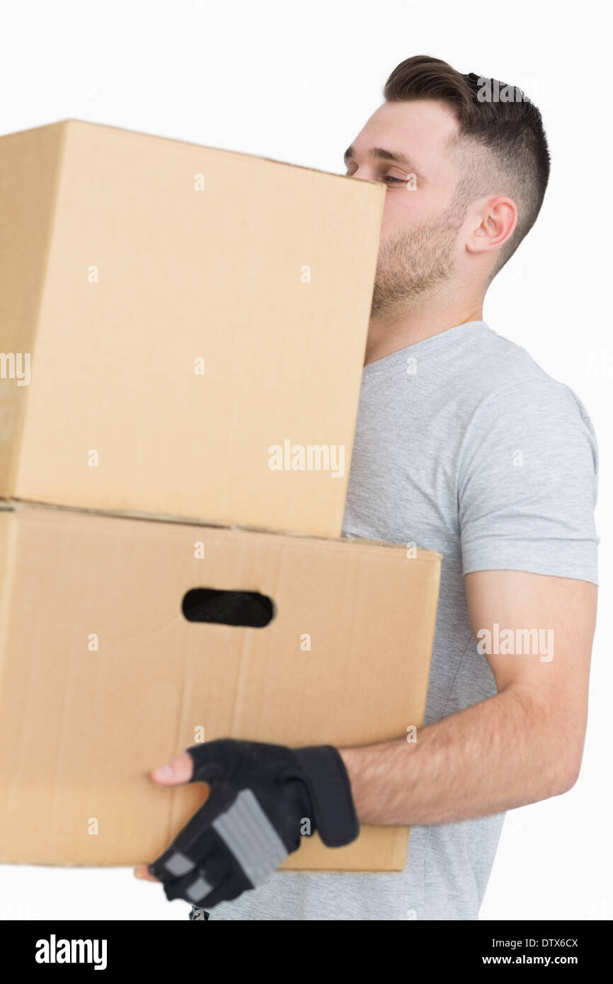 Young man carrying package boxes Stock Photo - Alamy