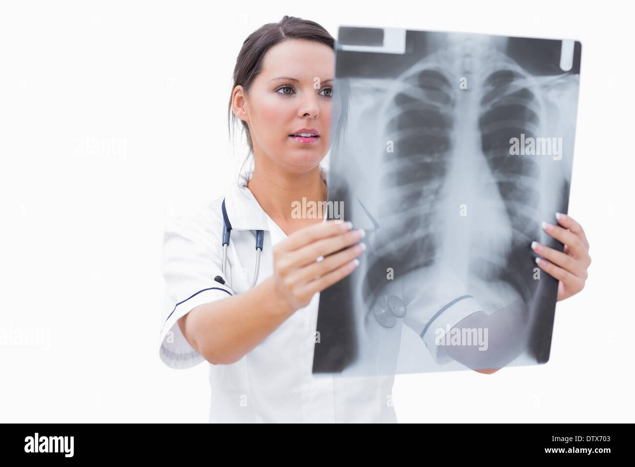 Young female nurse examining xray Stock Photo - Alamy