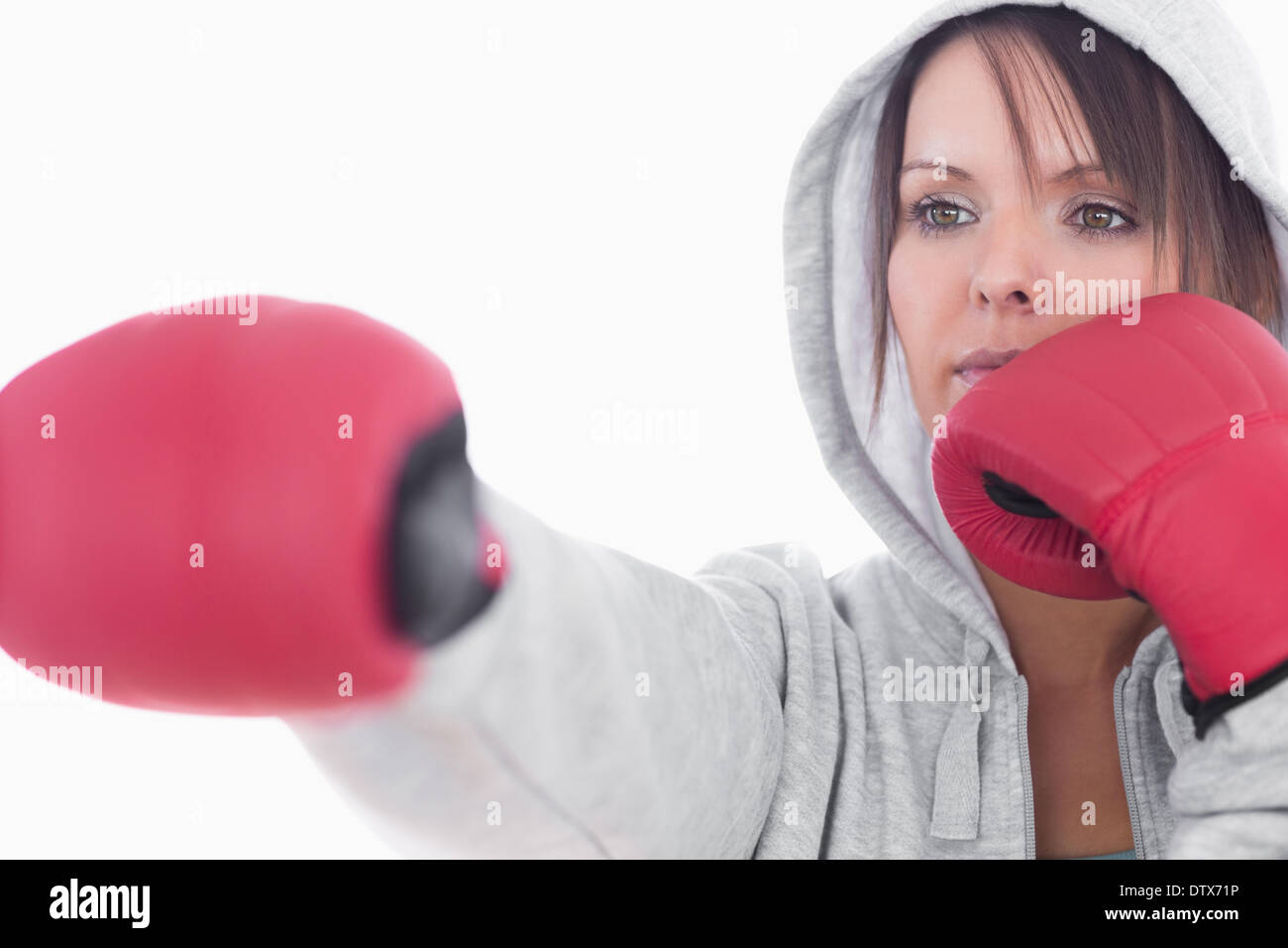 Serious young woman in boxing stance Stock Photo - Alamy