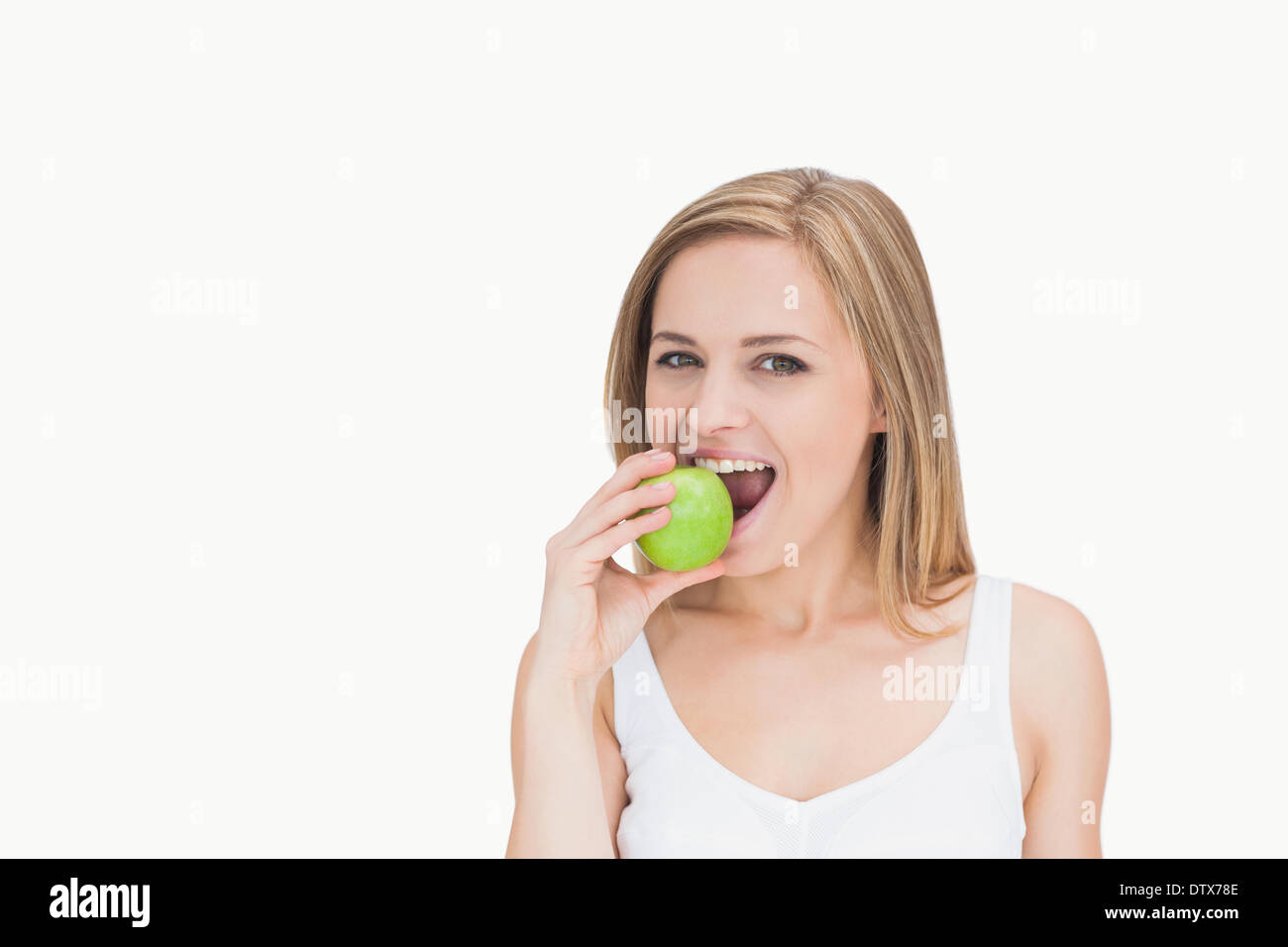 Woman eating green apple hi-res stock photography and images - Alamy