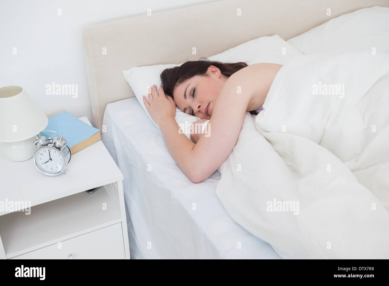 Woman in bed Stock Photo - Alamy