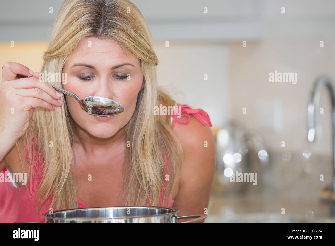 Woman tasting soup in hi-res stock photography and images - Alamy