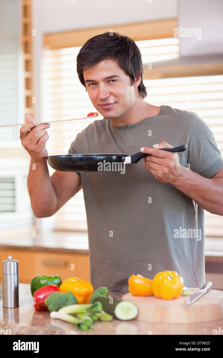 Man cooking food in the kitchen Stock Photo - Alamy