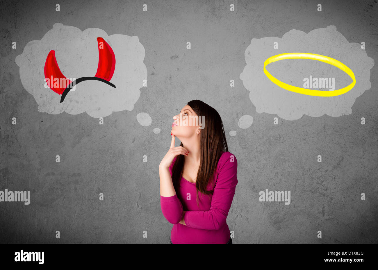 Woman choosing between good and bad Stock Photo - Alamy