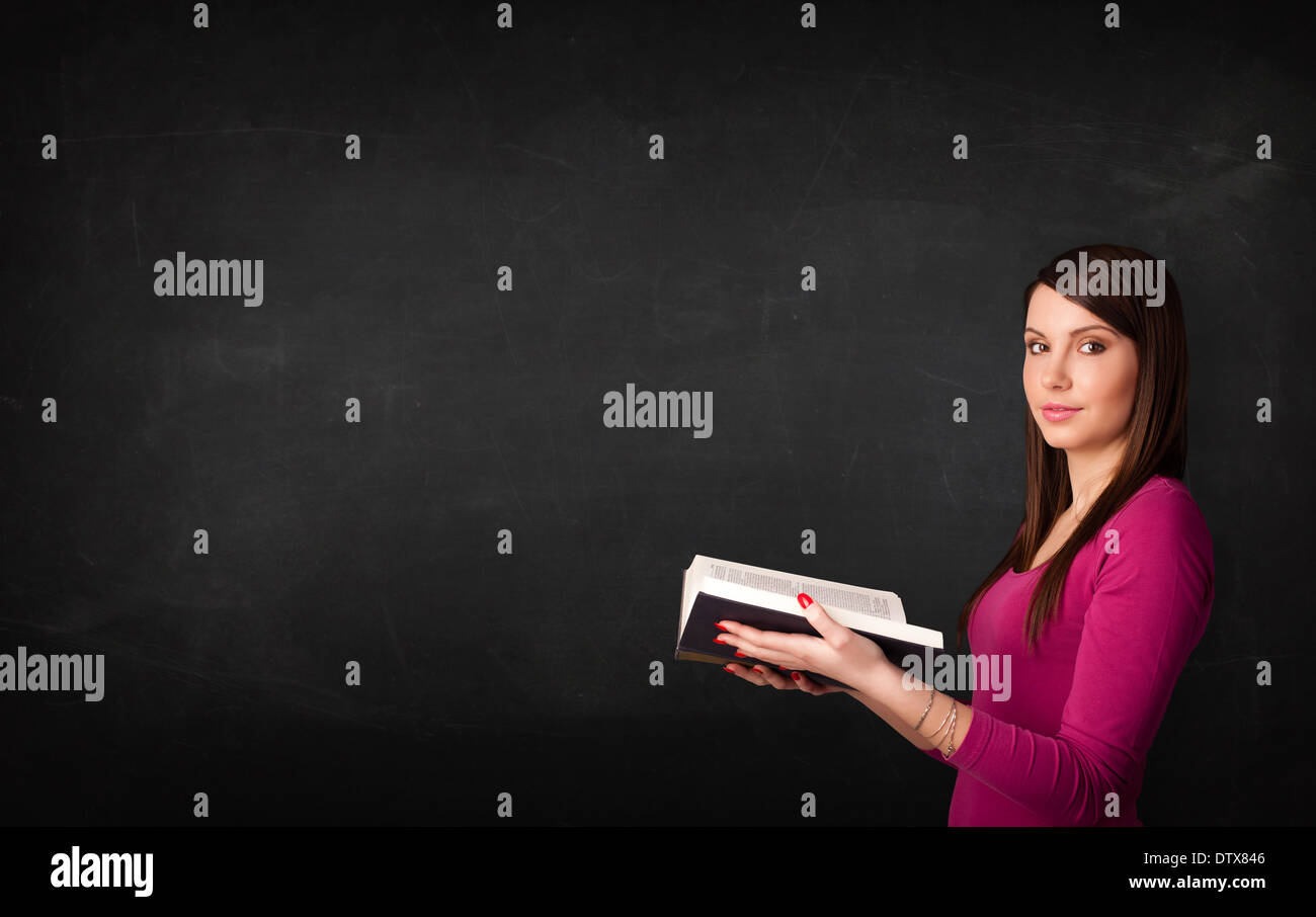 Young lady reading a book Stock Photo - Alamy