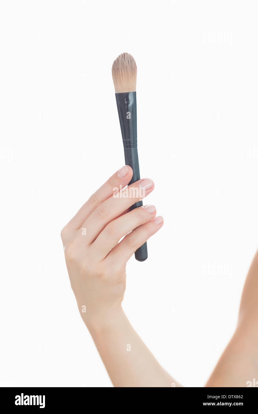 Hand holding makeup brush hi-res stock photography and images - Alamy