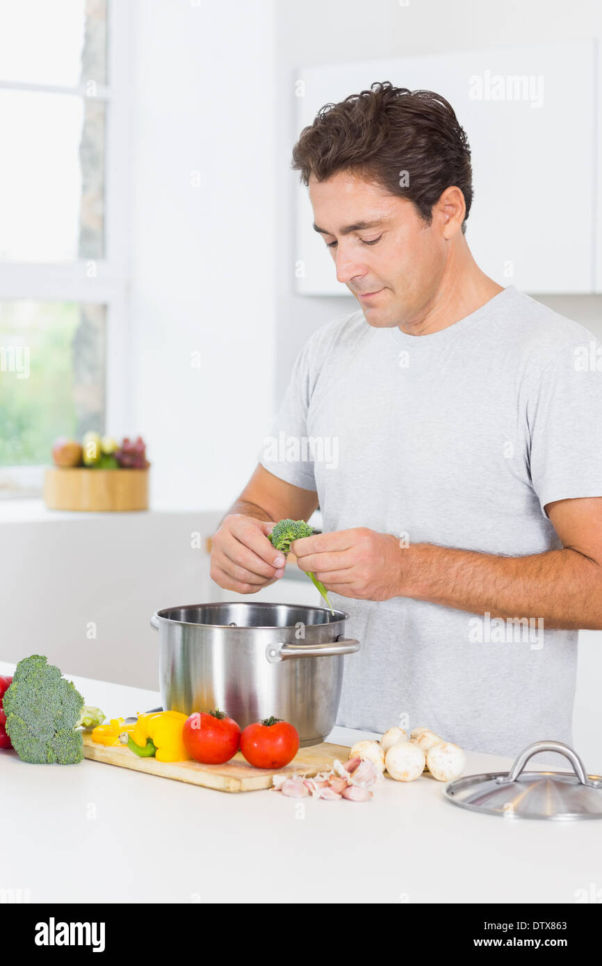 Man making dinner Stock Photo - Alamy