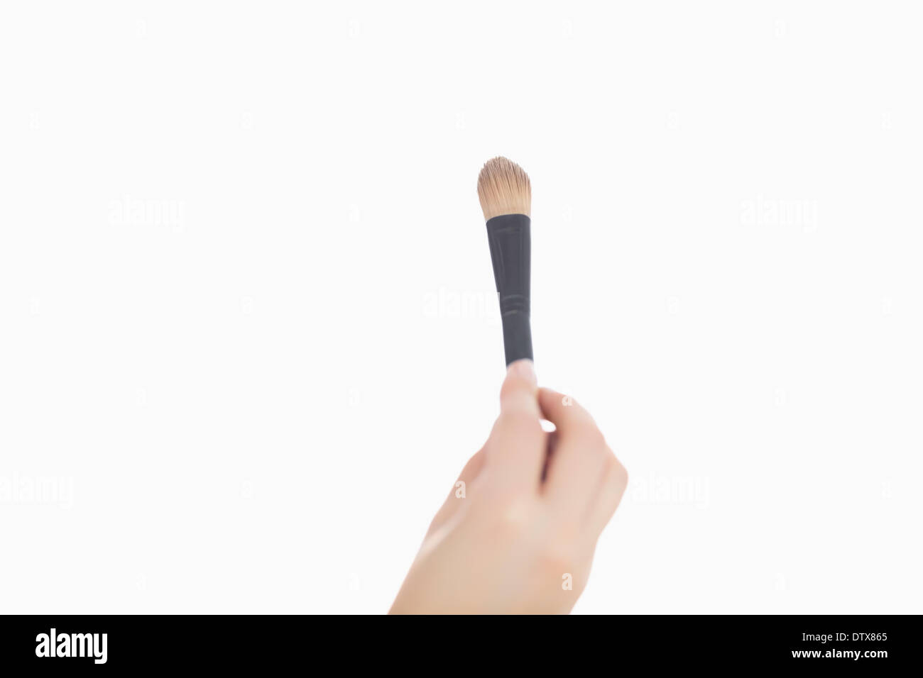 Hand holding makeup brush hi-res stock photography and images - Alamy