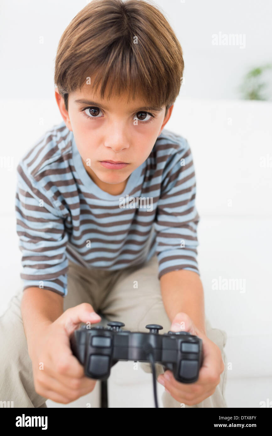 Boy playing video games Stock Photo - Alamy
