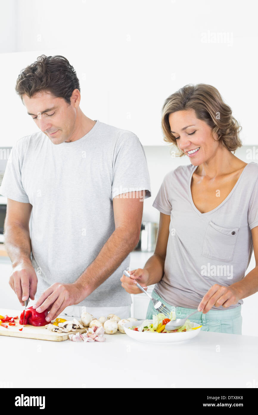 Mature couple preparing fresh salad hi-res stock photography and images ...