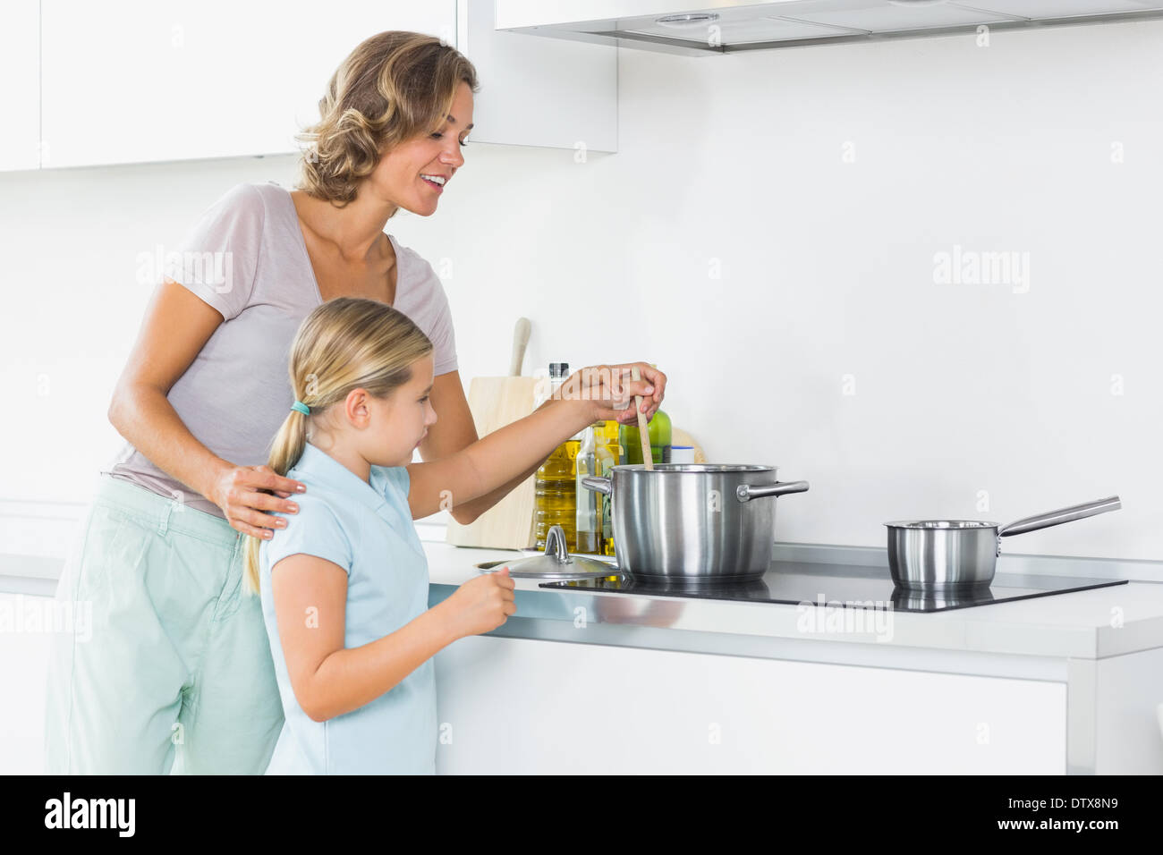 Mother and daughter preparing dinner Stock Photo - Alamy