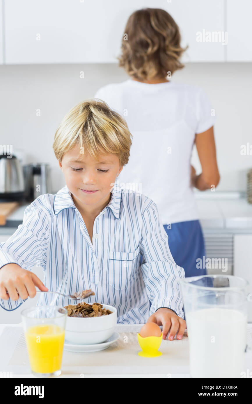 Young boy having breakfast Stock Photo - Alamy