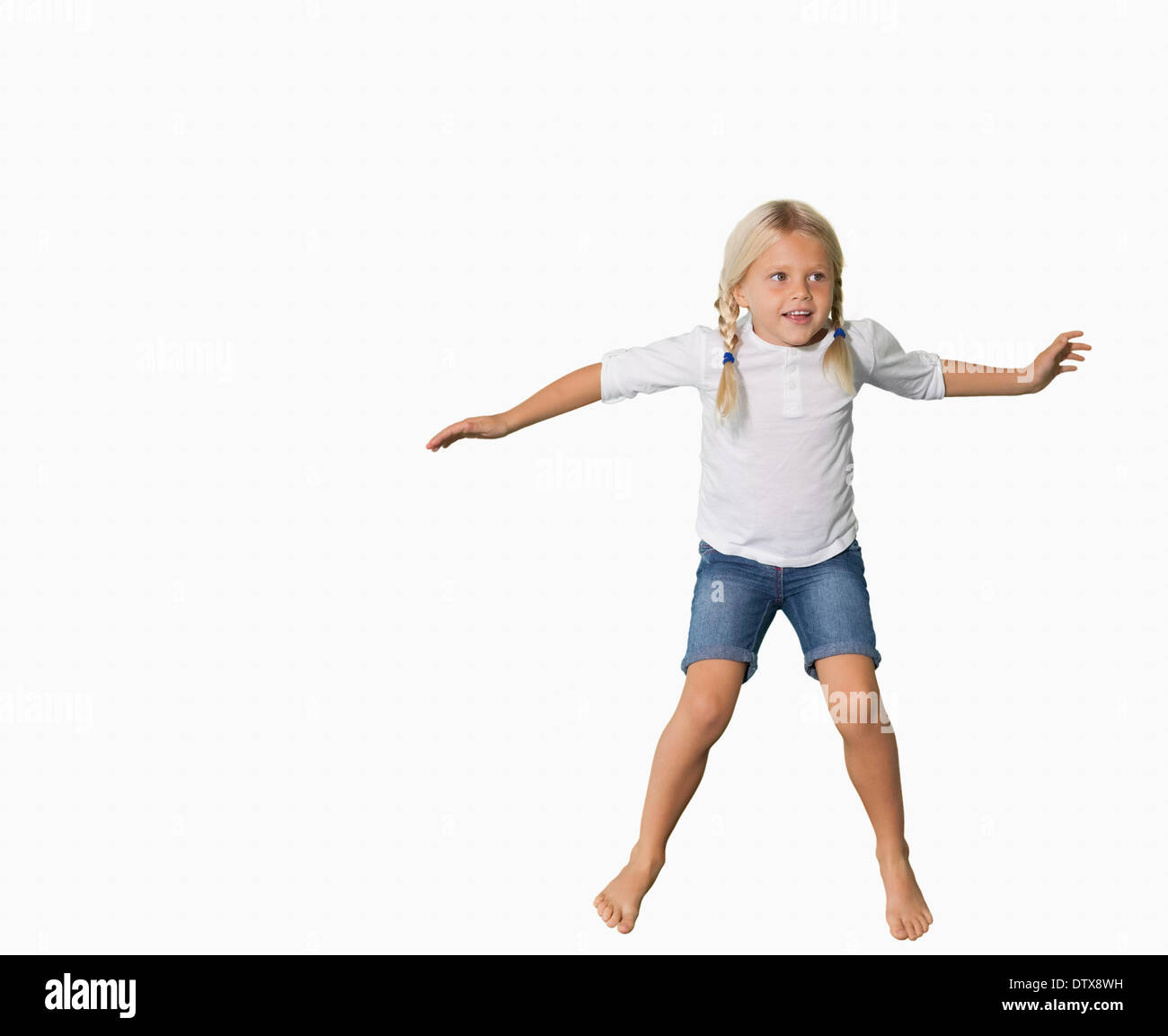 Little girl jumping Stock Photo - Alamy
