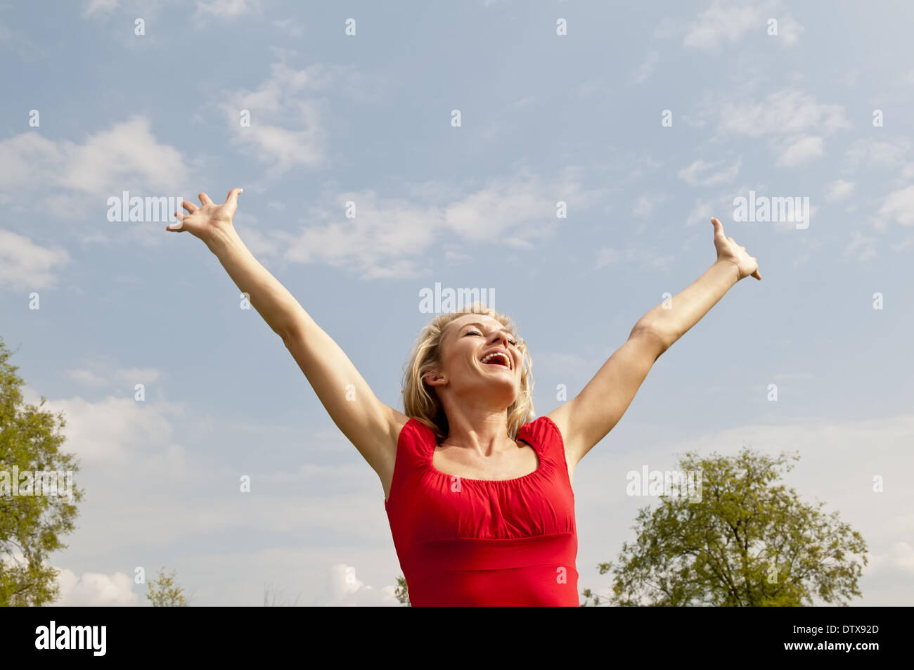 happy woman cheering Stock Photo - Alamy